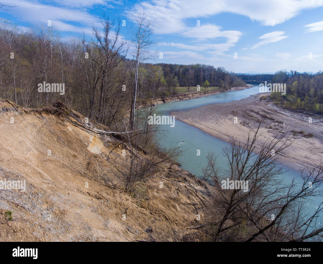 Bend in the river and clay crumbling shore with trees. Drone photo ...