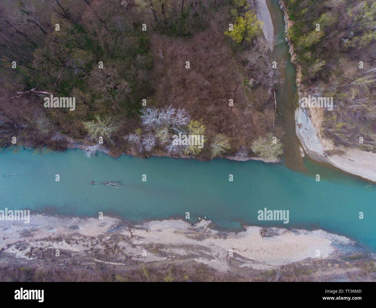 Aerial view to the small river flowing into a larger one Stock Photo ...