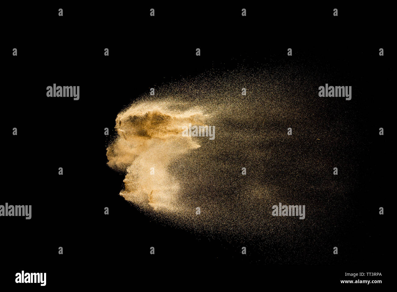 Brown dry river sand explosion isolated on black background. Abstract ...
