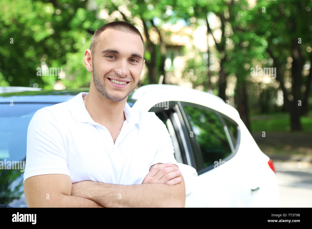Man near car Stock Photo - Alamy