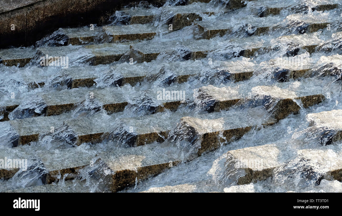 Water flowing down man made bricks in a series of cascade Stock Photo ...