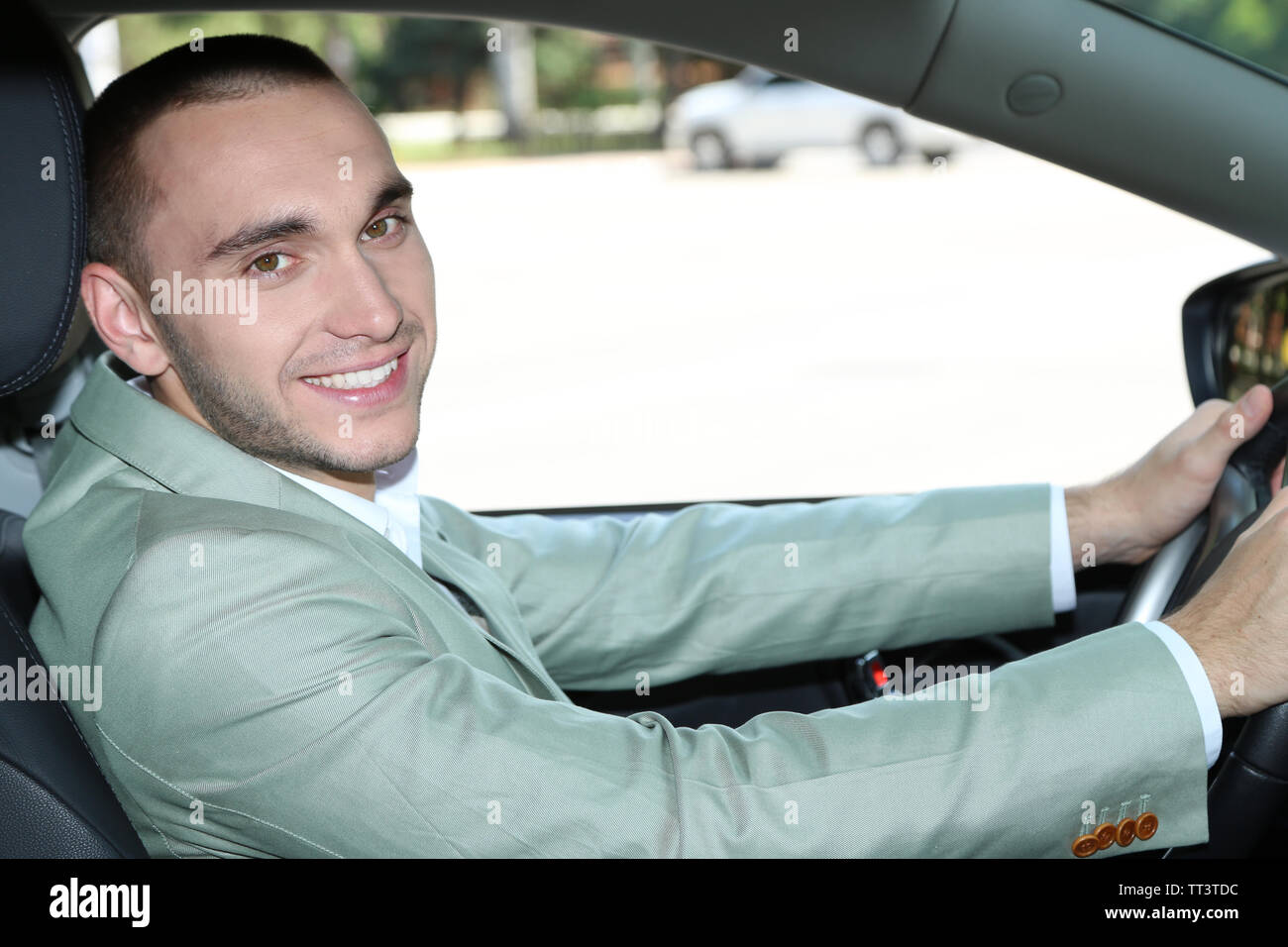 Man sitting in car Stock Photo - Alamy