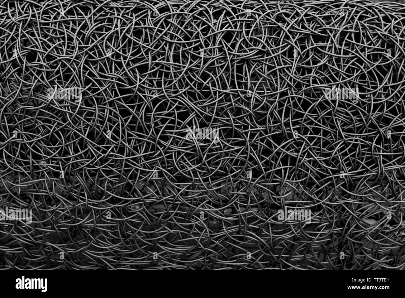 Black messy metal wire braiding. Steel textured background Stock Photo ...