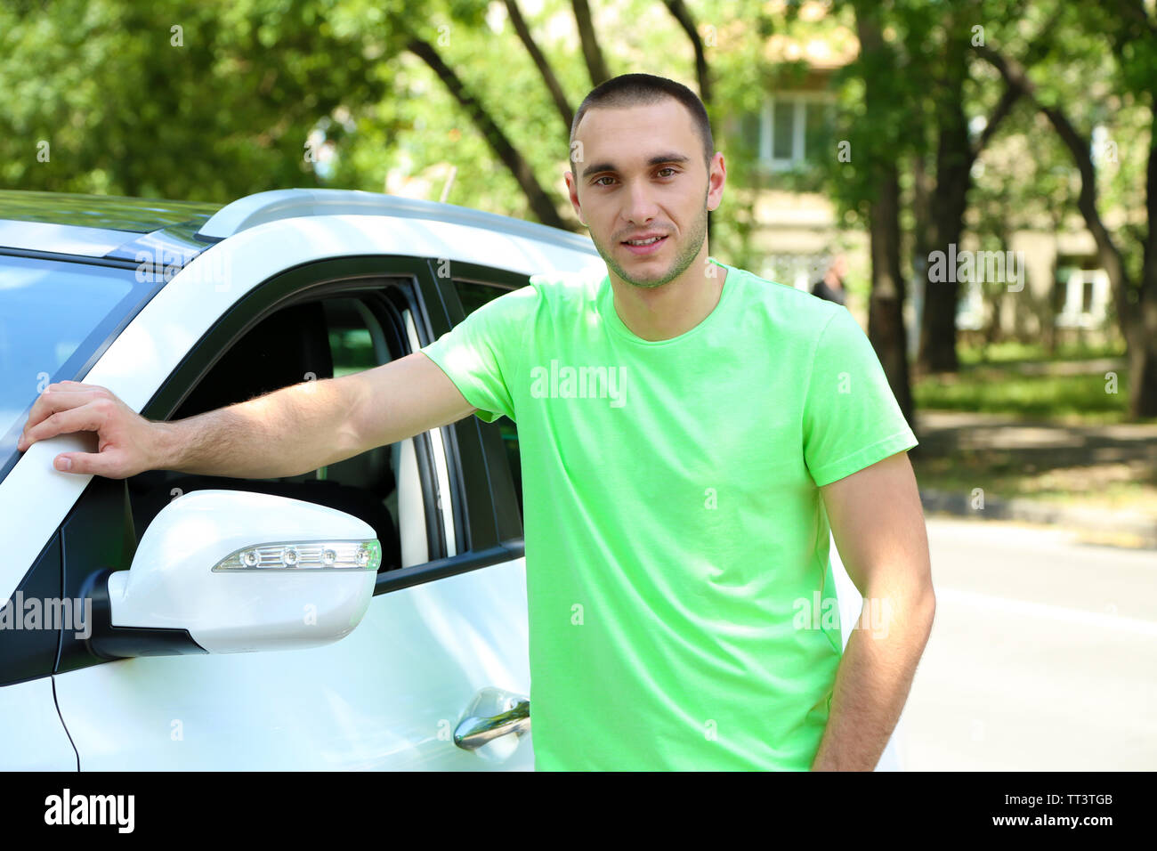 Man near car Stock Photo - Alamy