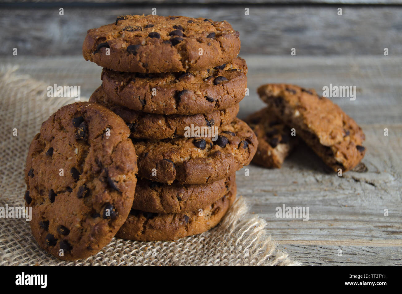 Chocolate chip cookies. Burlap and old wooden table, background Stock ...