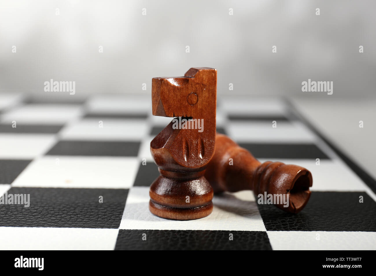 Chess board with chess pieces on grey background Stock Photo - Alamy