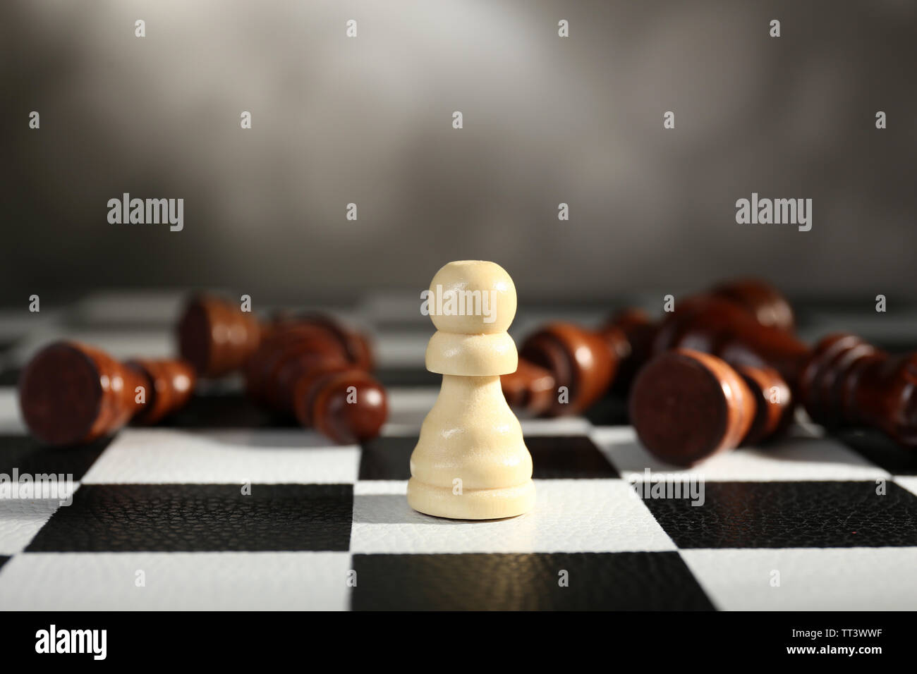 Chess board with chess pieces on grey background Stock Photo - Alamy