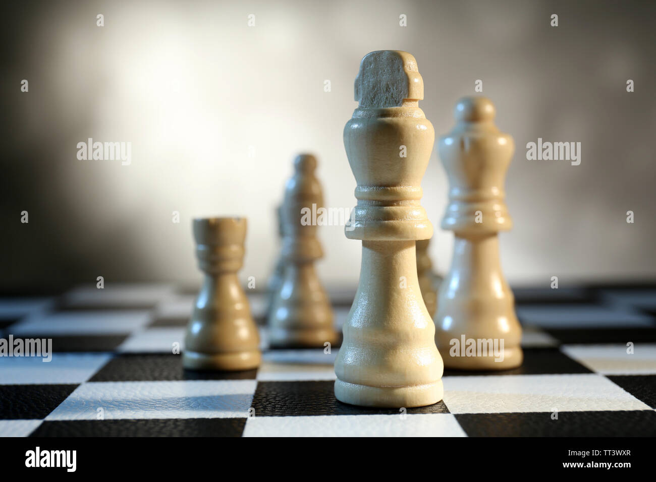 Chess board with chess pieces on grey background Stock Photo - Alamy