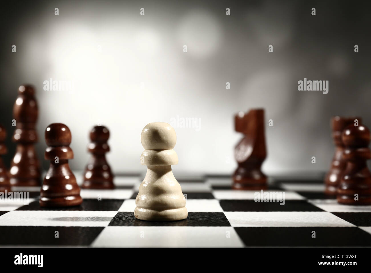 Chess board with chess pieces on grey background Stock Photo - Alamy