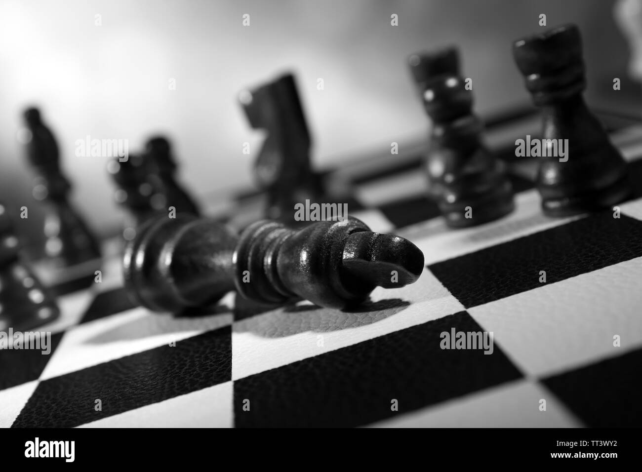 Chess board with chess pieces on grey background Stock Photo - Alamy