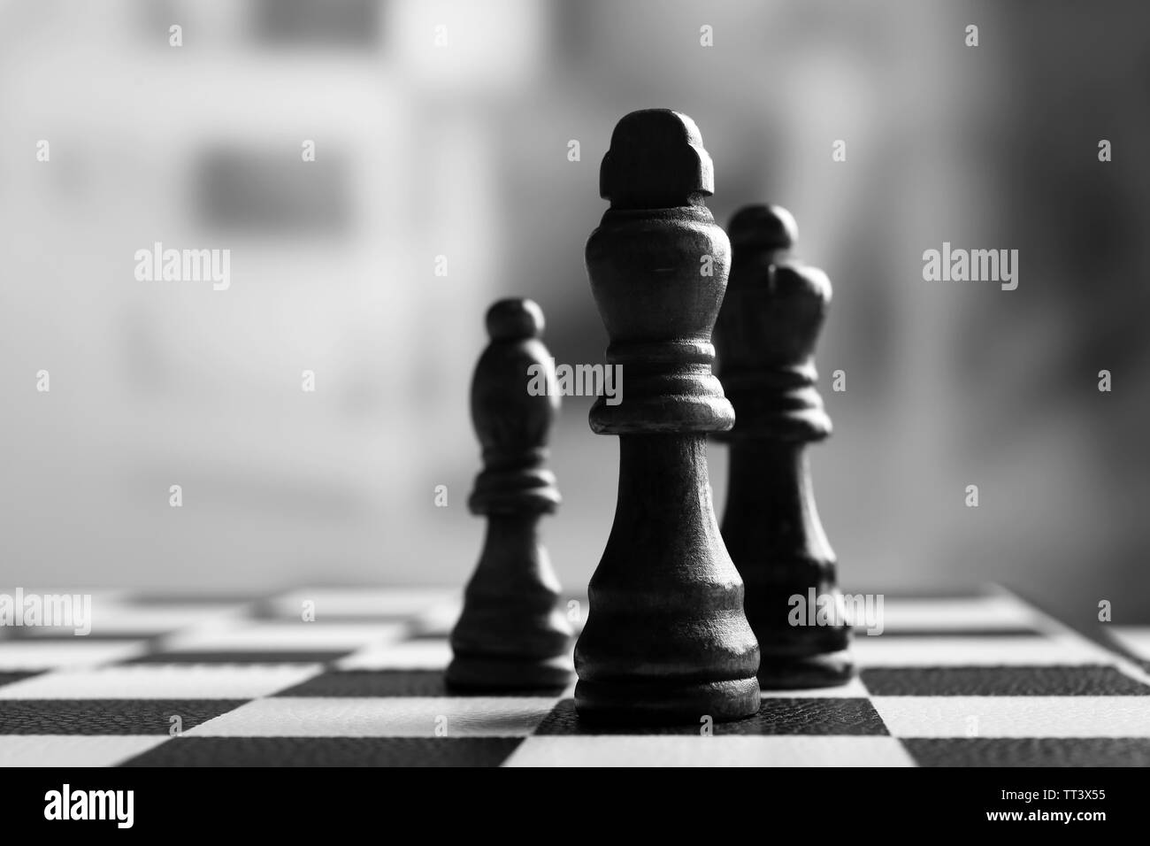 Chess board with chess pieces on grey background Stock Photo - Alamy