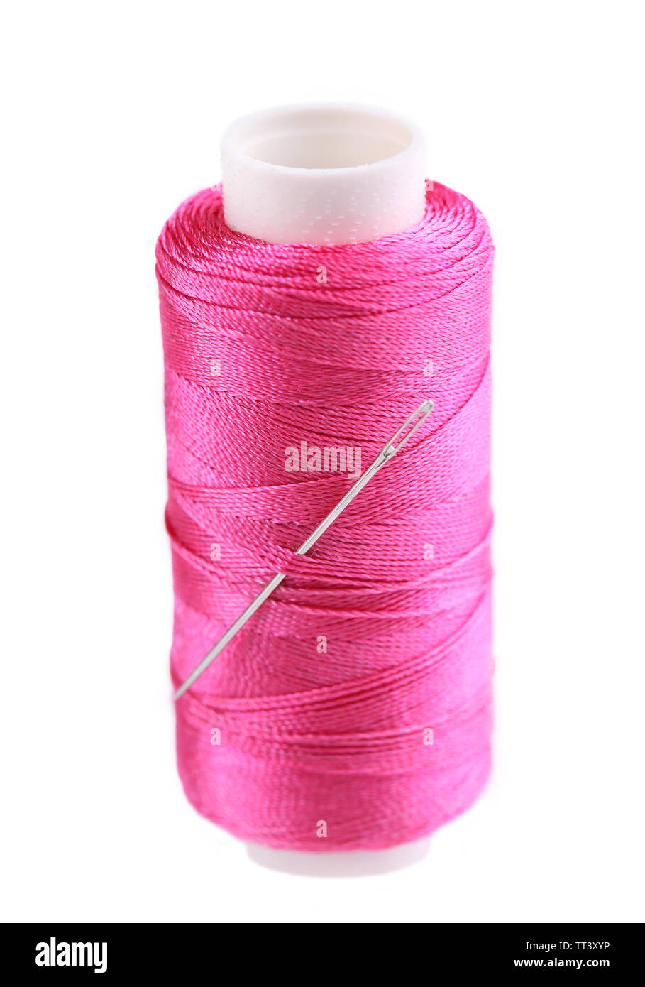 Needle and spool of thread isolated on white Stock Photo - Alamy
