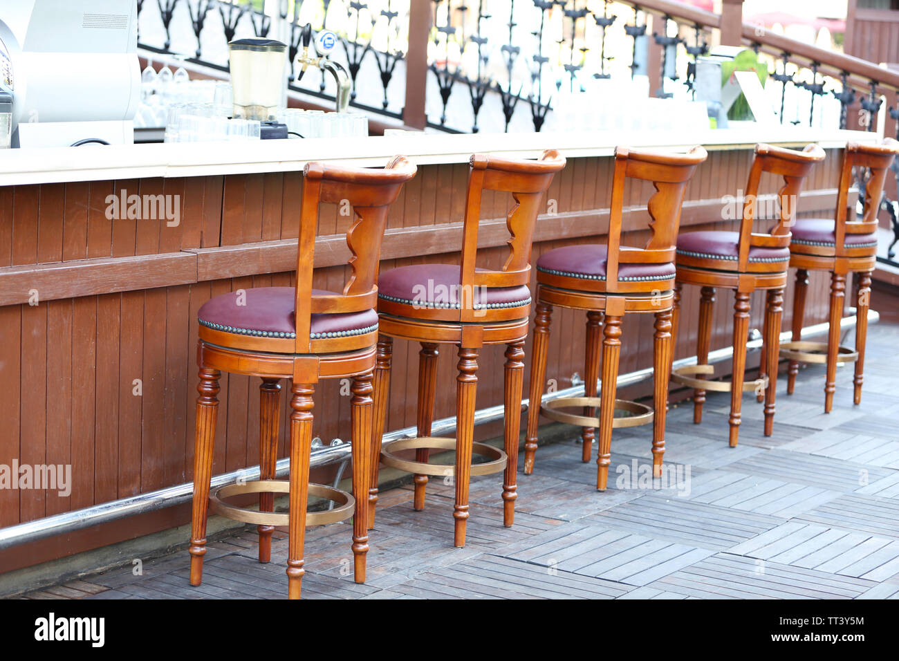Street bar chairs in row, outside Stock Photo - Alamy