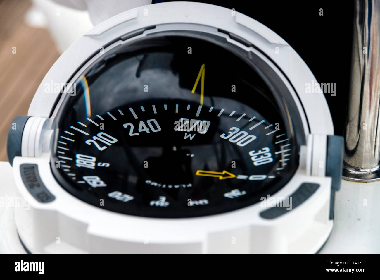 Nautic compass on a sailing yacht Stock Photo - Alamy