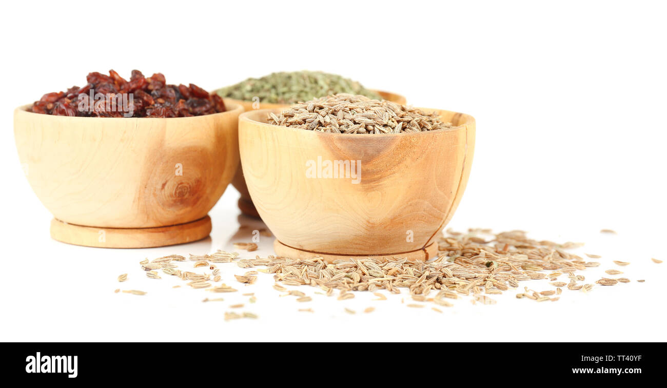 Round wooden bowls full of seasoning on white background isolated Stock ...
