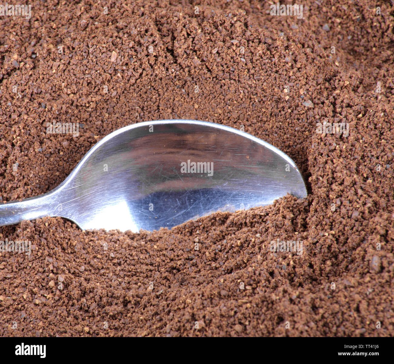 milled coffee background and teaspoon Stock Photo - Alamy