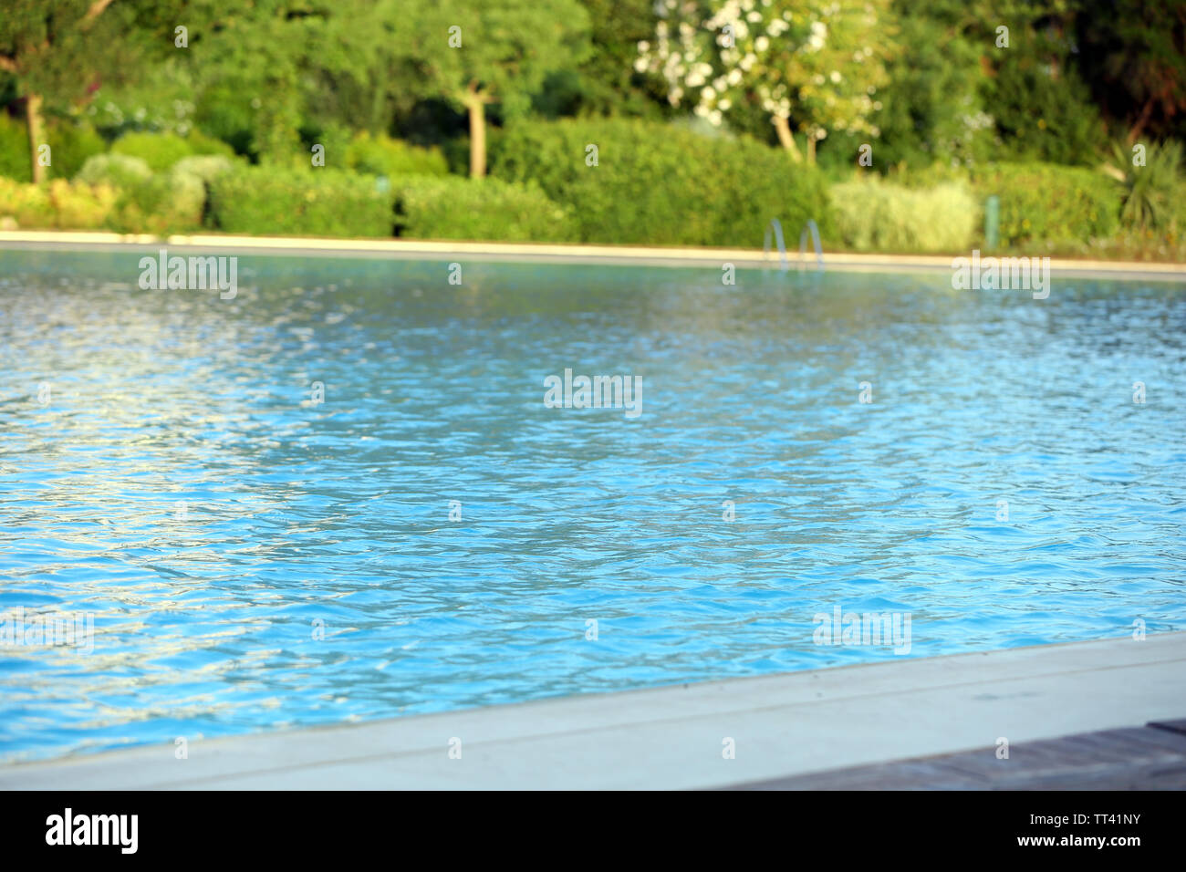 Blue water in swimming pool Stock Photo - Alamy