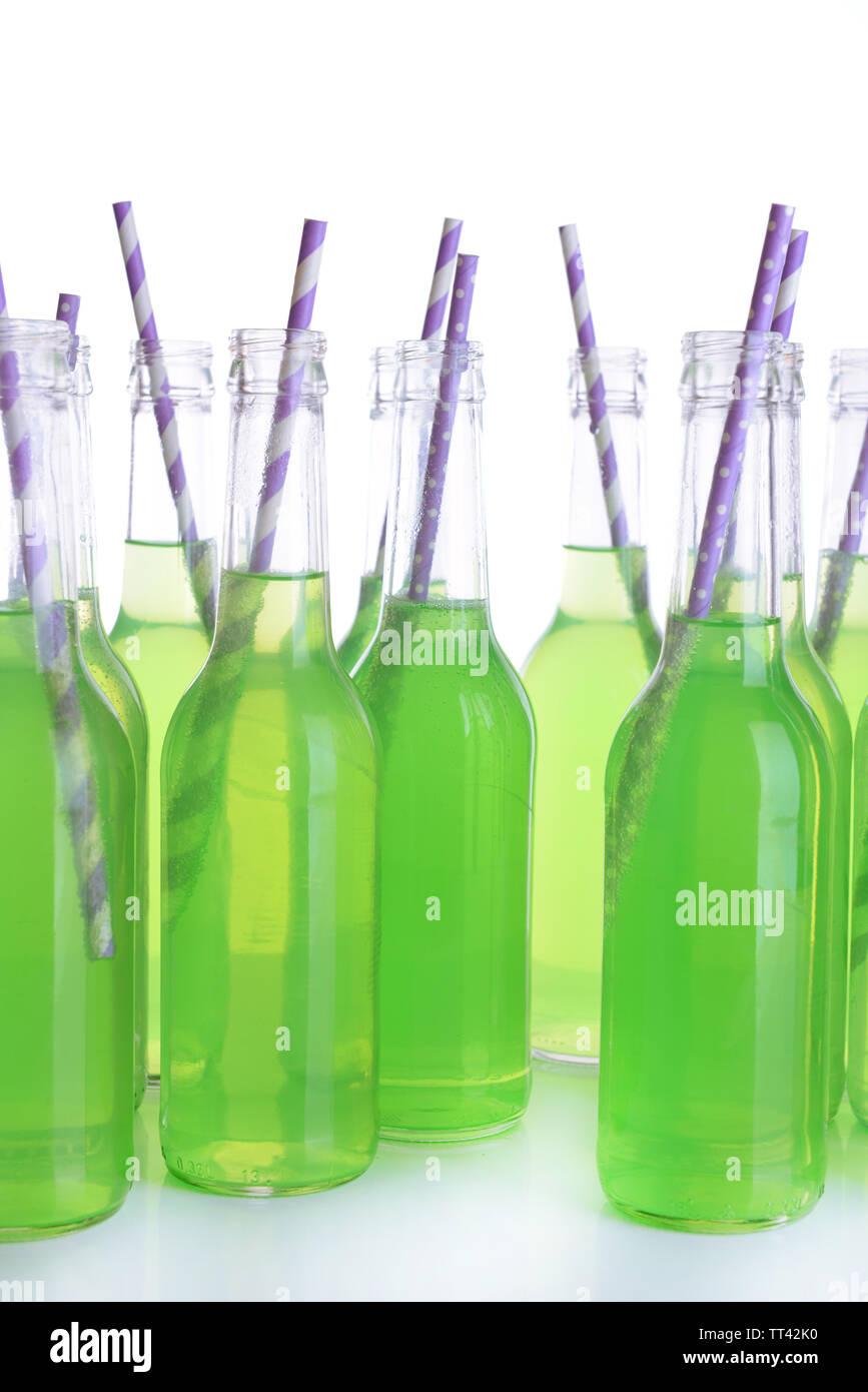 Bottles of drink with straw isolated on white Stock Photo - Alamy