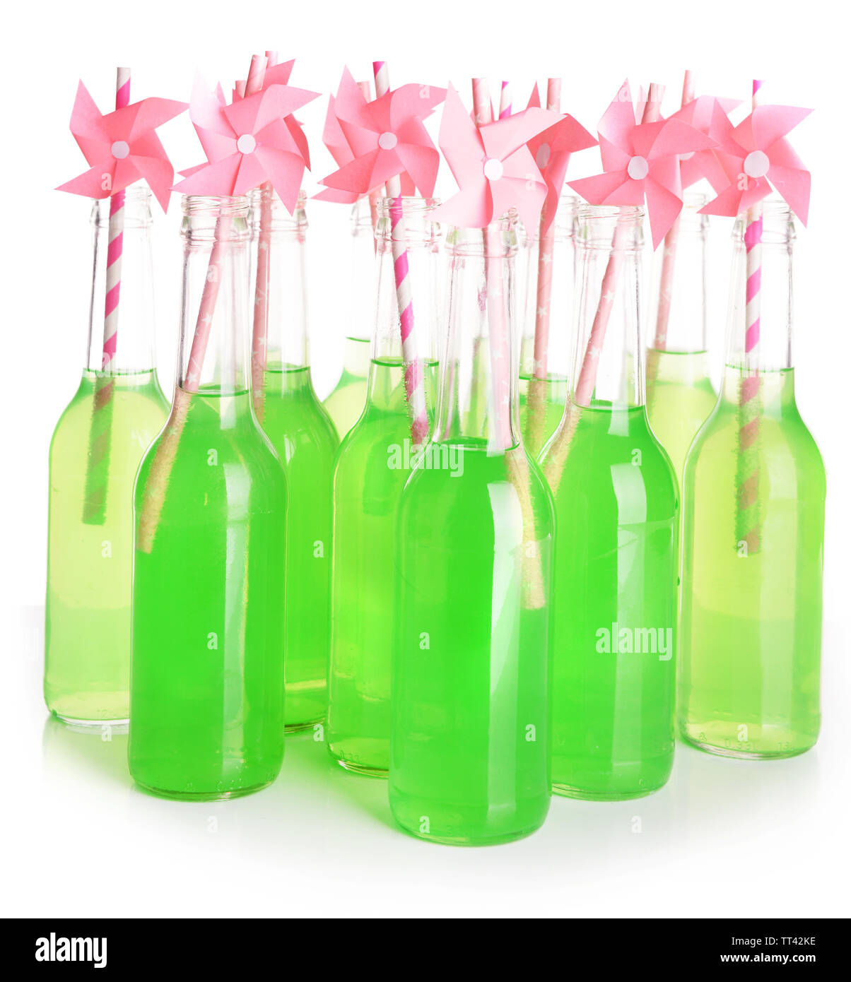 Bottles of drink with straw on light background Stock Photo - Alamy