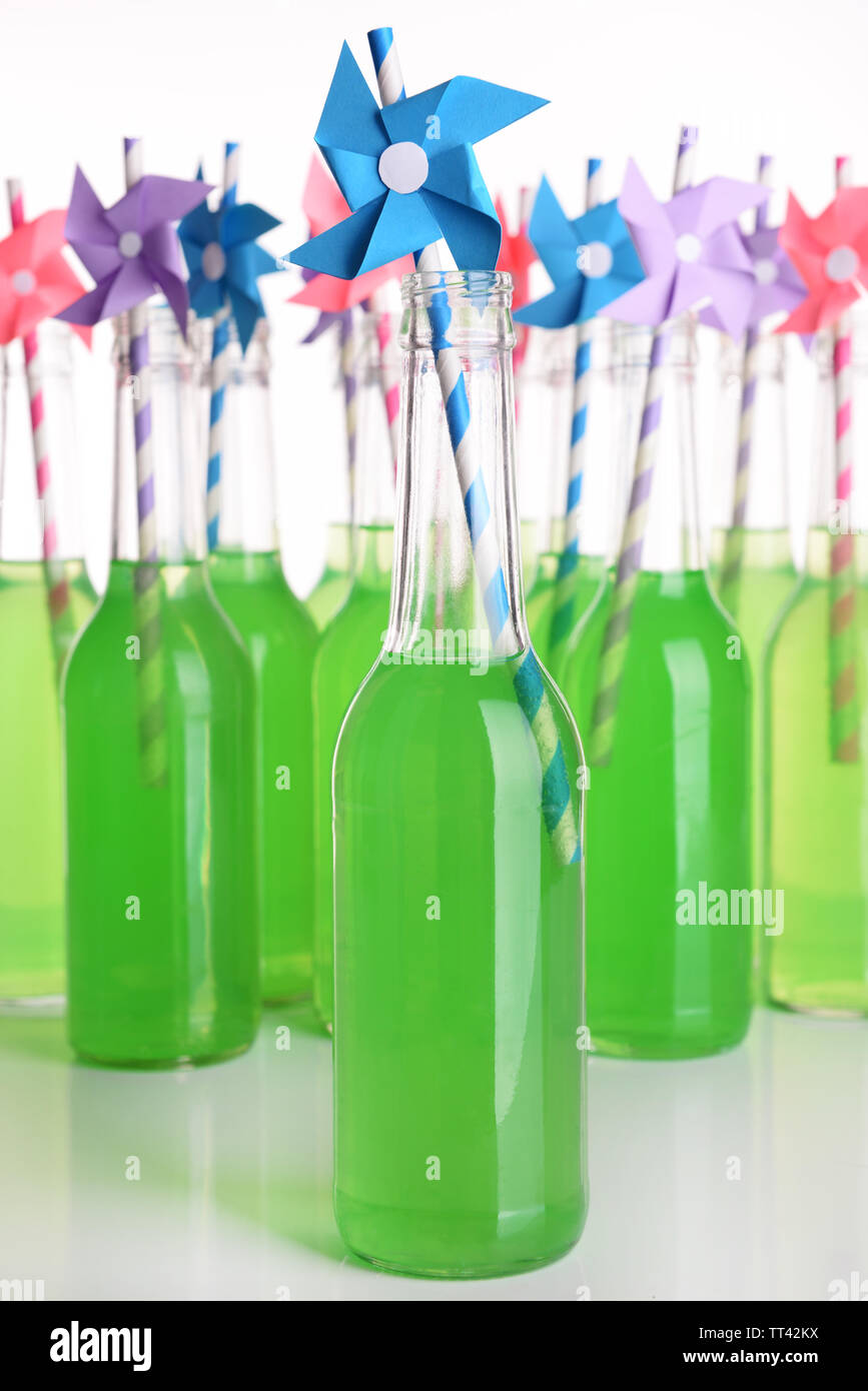 Bottles of drink with straw isolated on white Stock Photo - Alamy