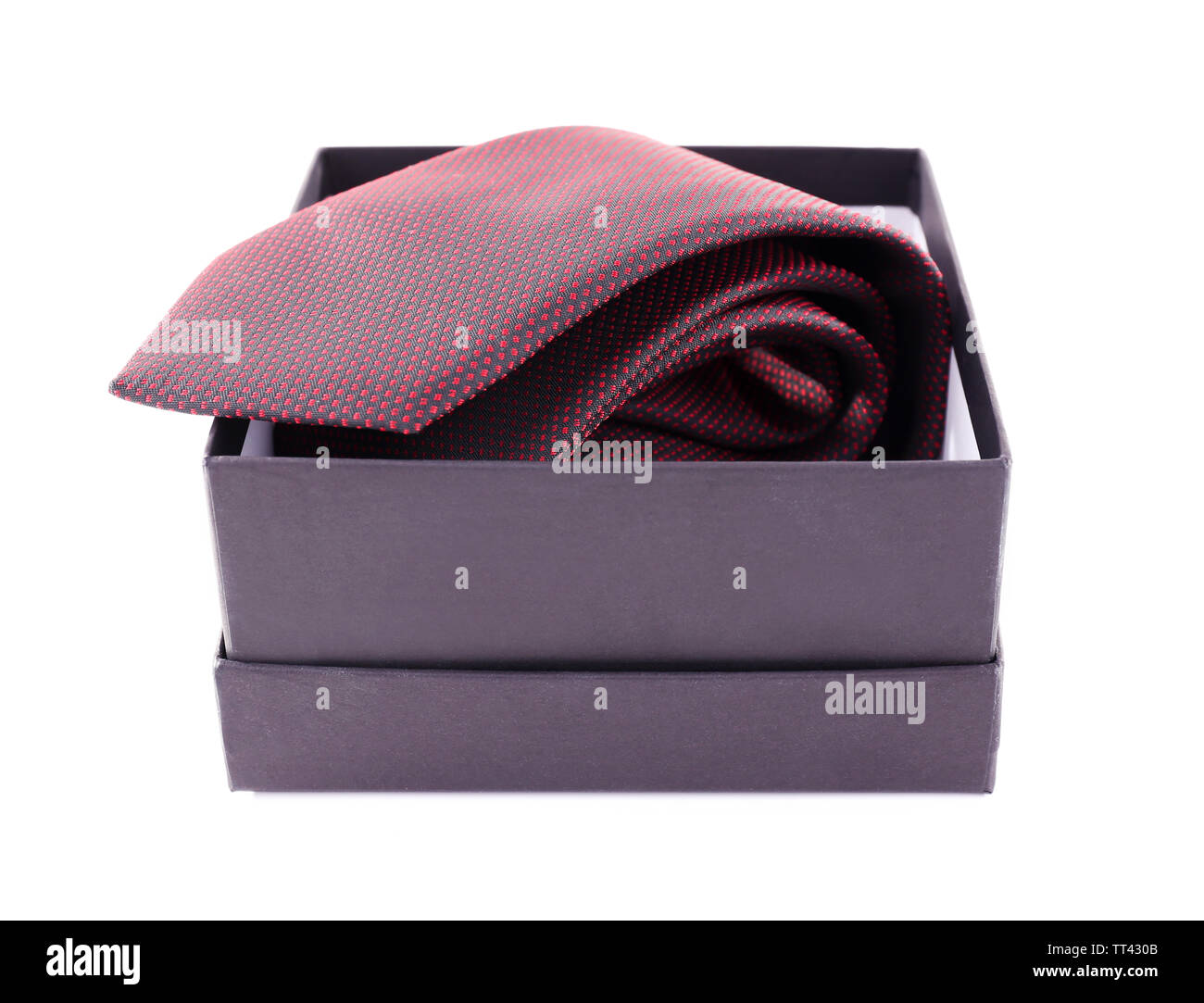 Brown tie in a square dark grey box on white background isolated Stock ...