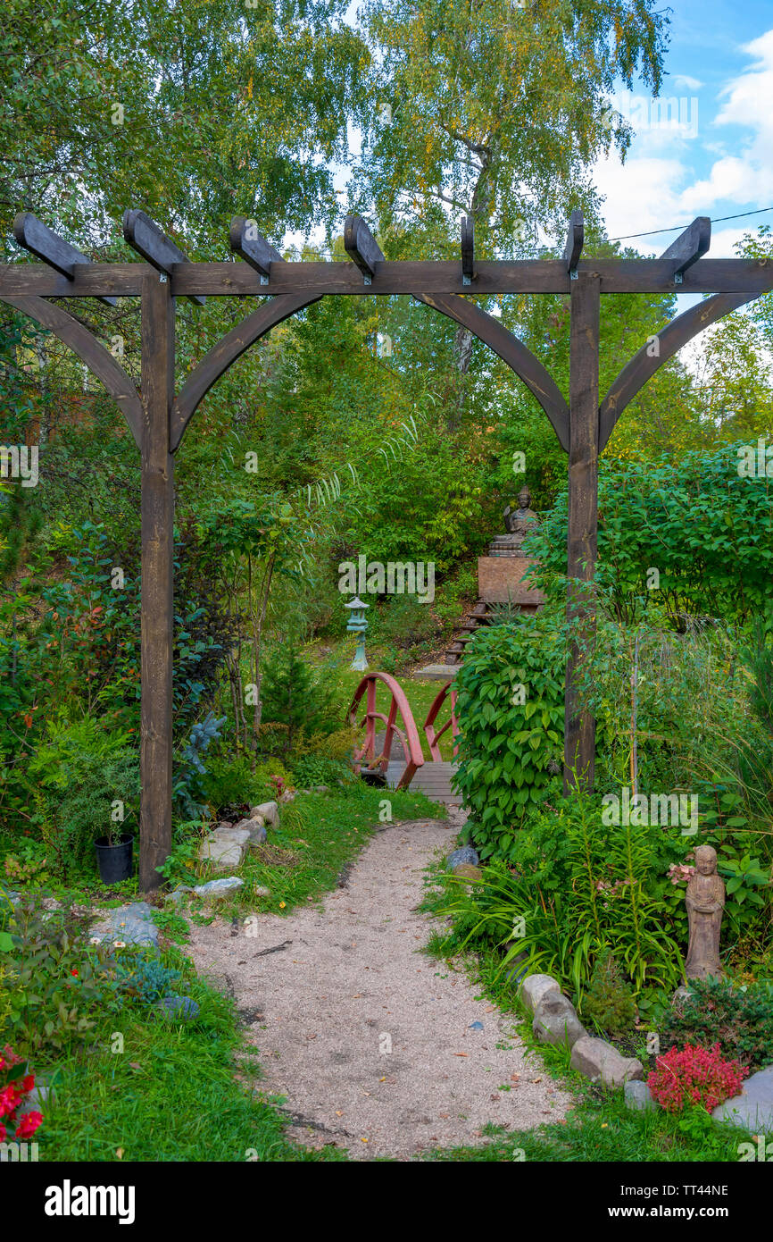 Decorative path in a beautiful garden in early autumn Stock Photo - Alamy