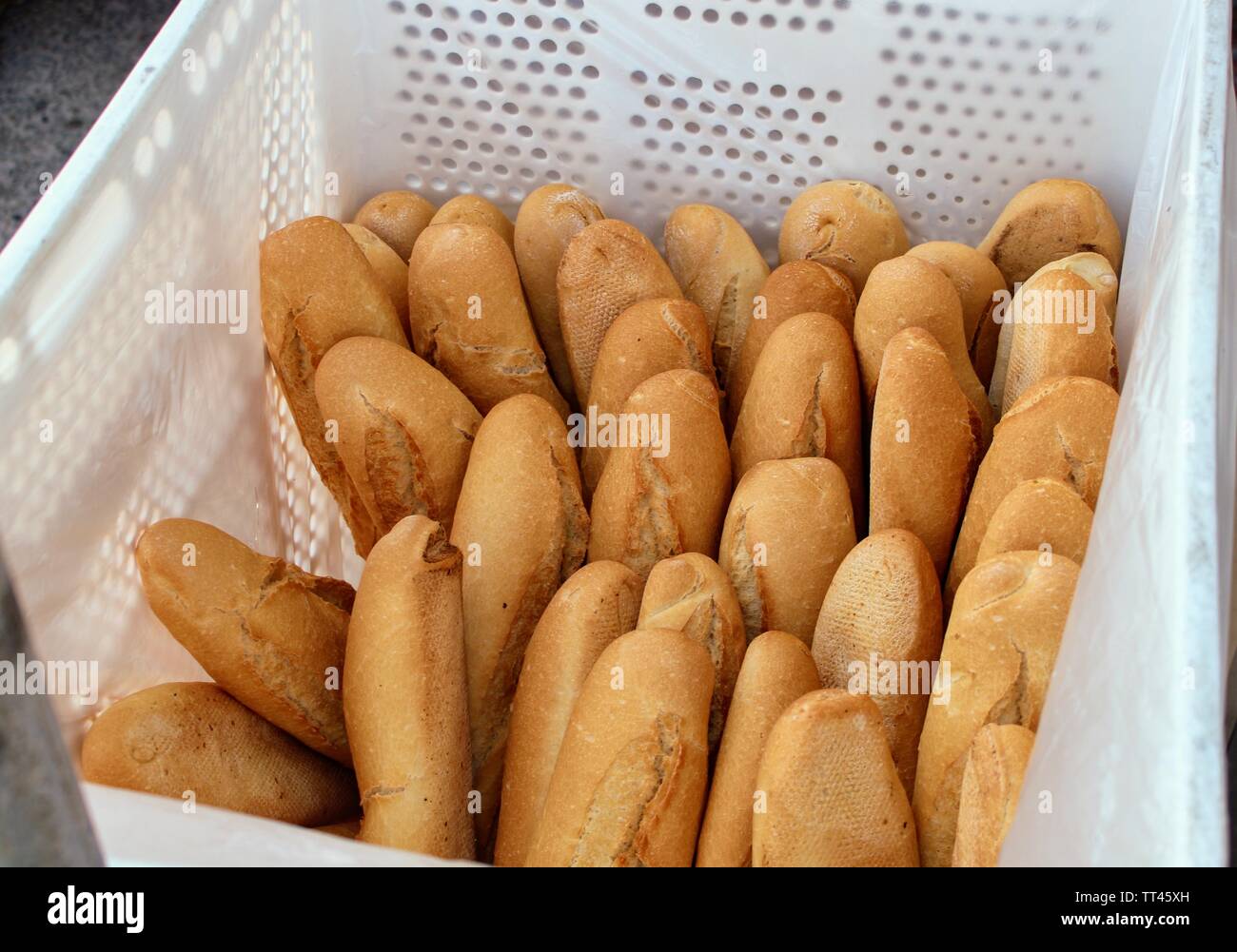 Plastic box full of freshly baked bread and ready to sell Stock Photo ...