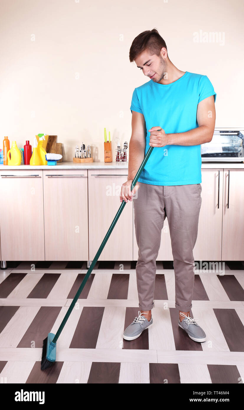 Sweeping mopping floor kitchen hi-res stock photography and images - Alamy
