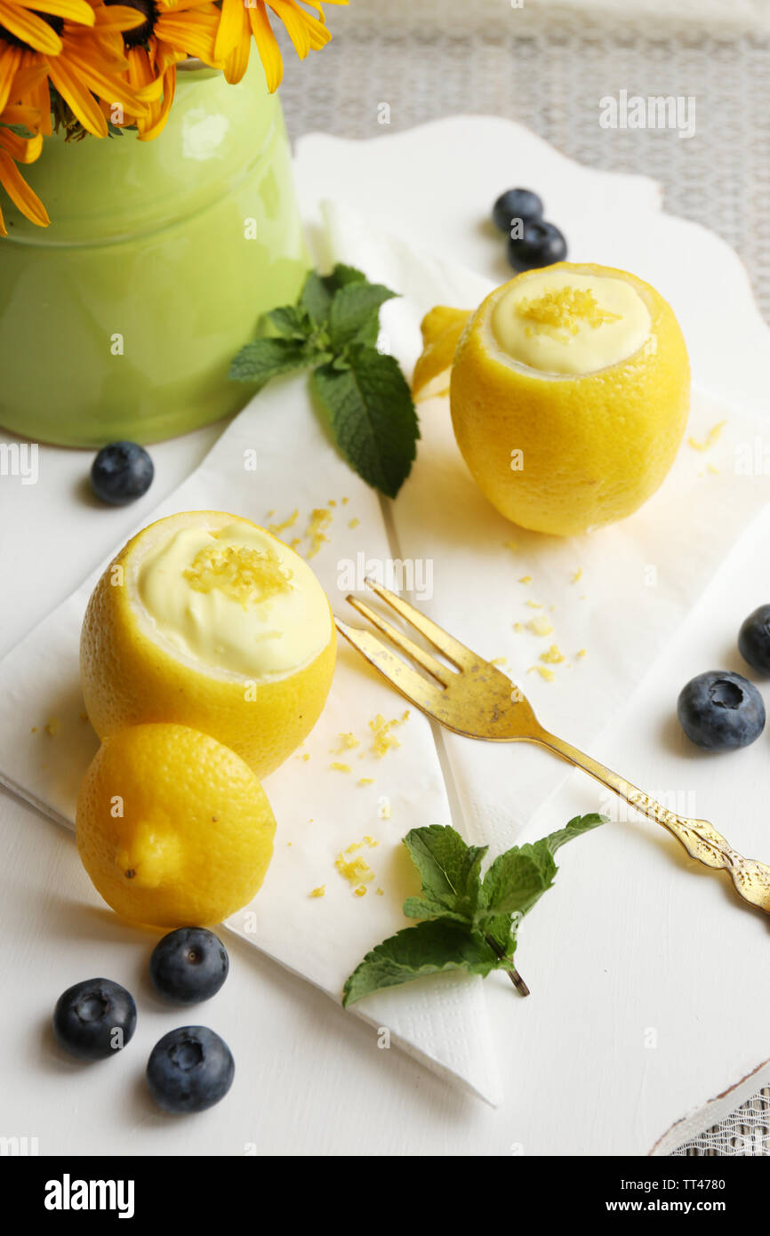 Tasty lemon dessert in lemon peel, close up Stock Photo - Alamy