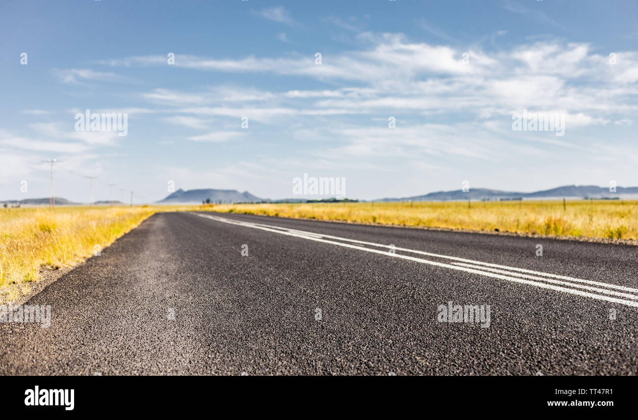 View of an empty country highway road in South African Farmland region ...