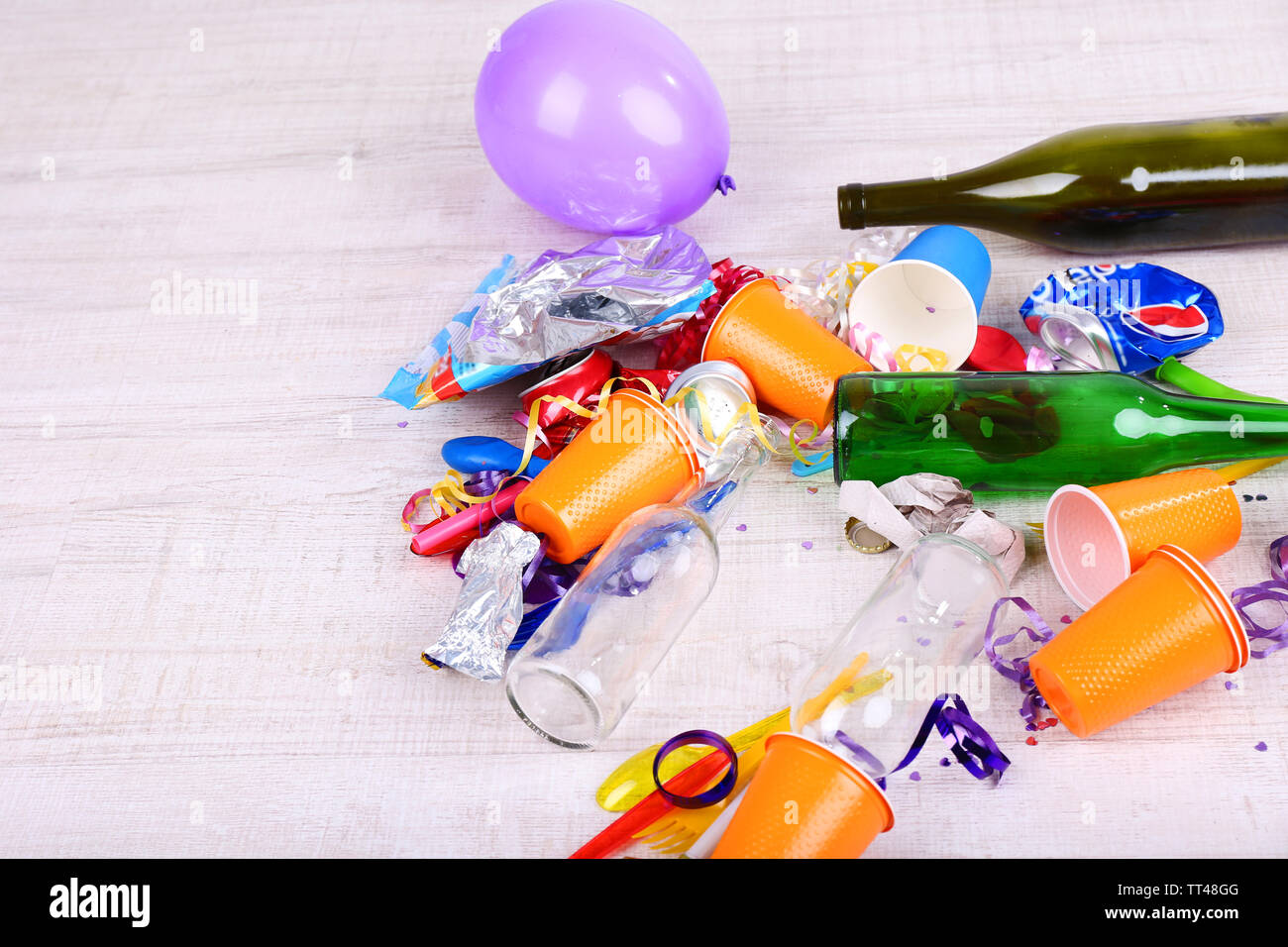 Heap of mess on grey wooden floor Stock Photo - Alamy
