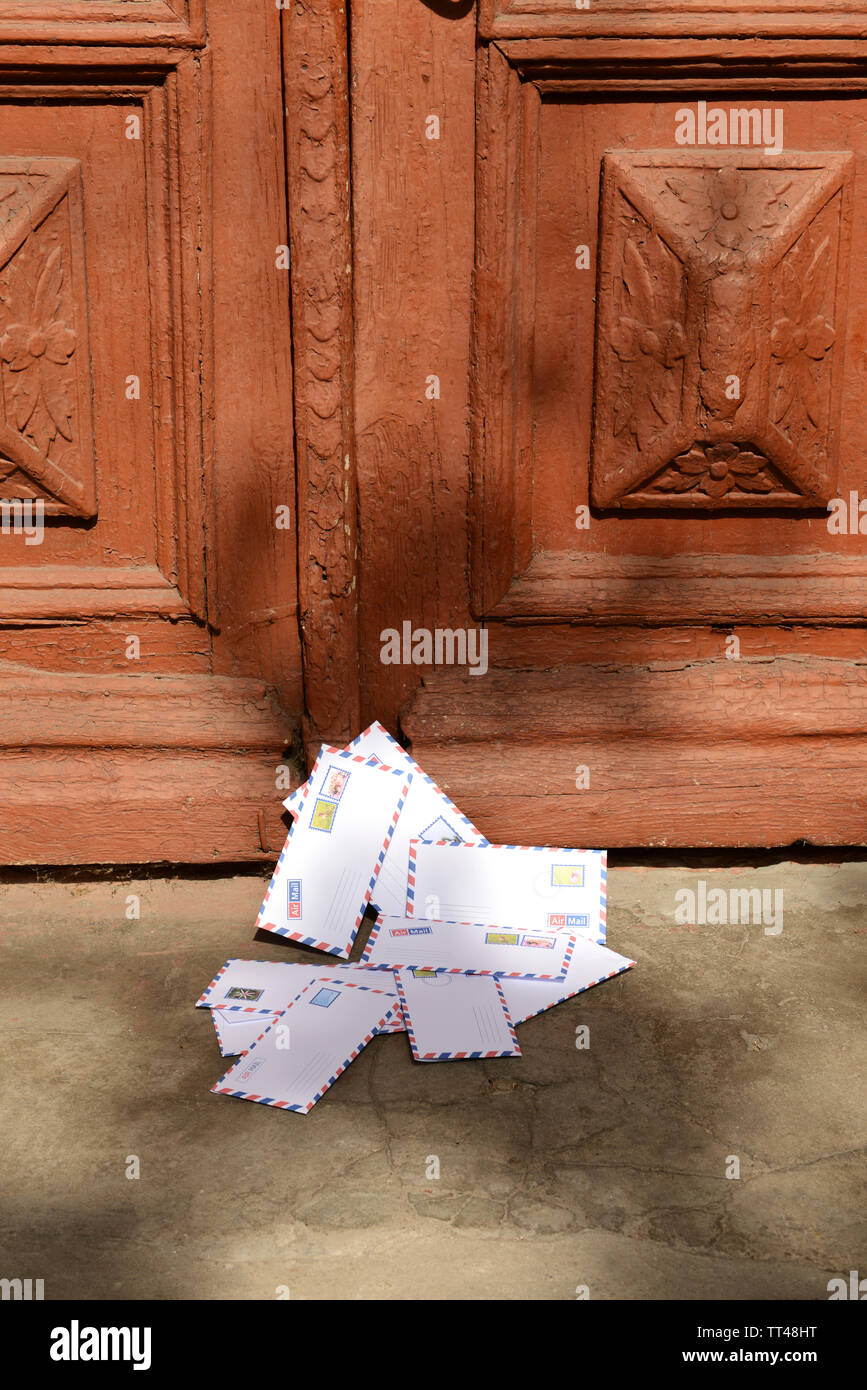 Letters on floor at front door Stock Photo - Alamy