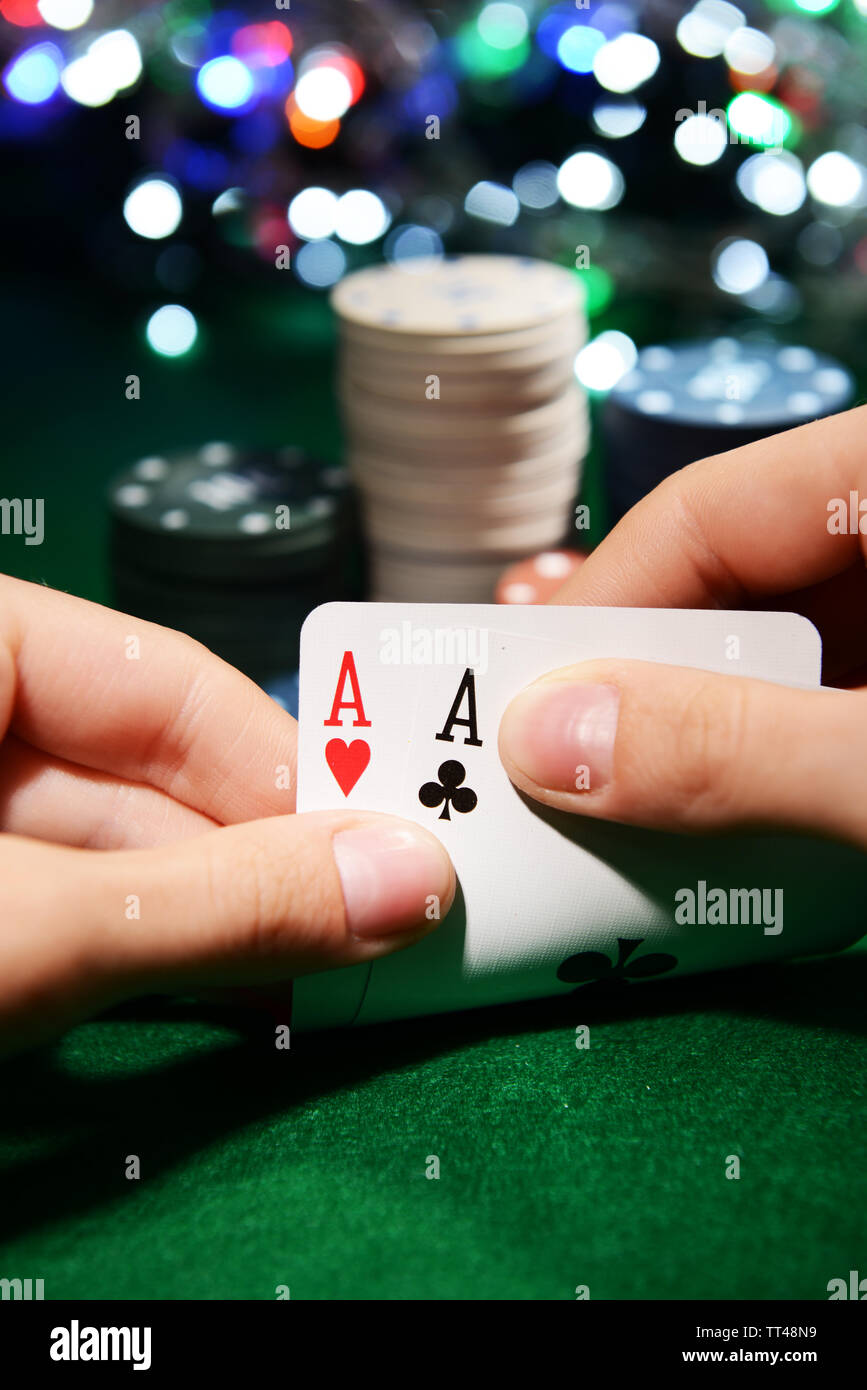 Poker chips in hands hi-res stock photography and images - Alamy