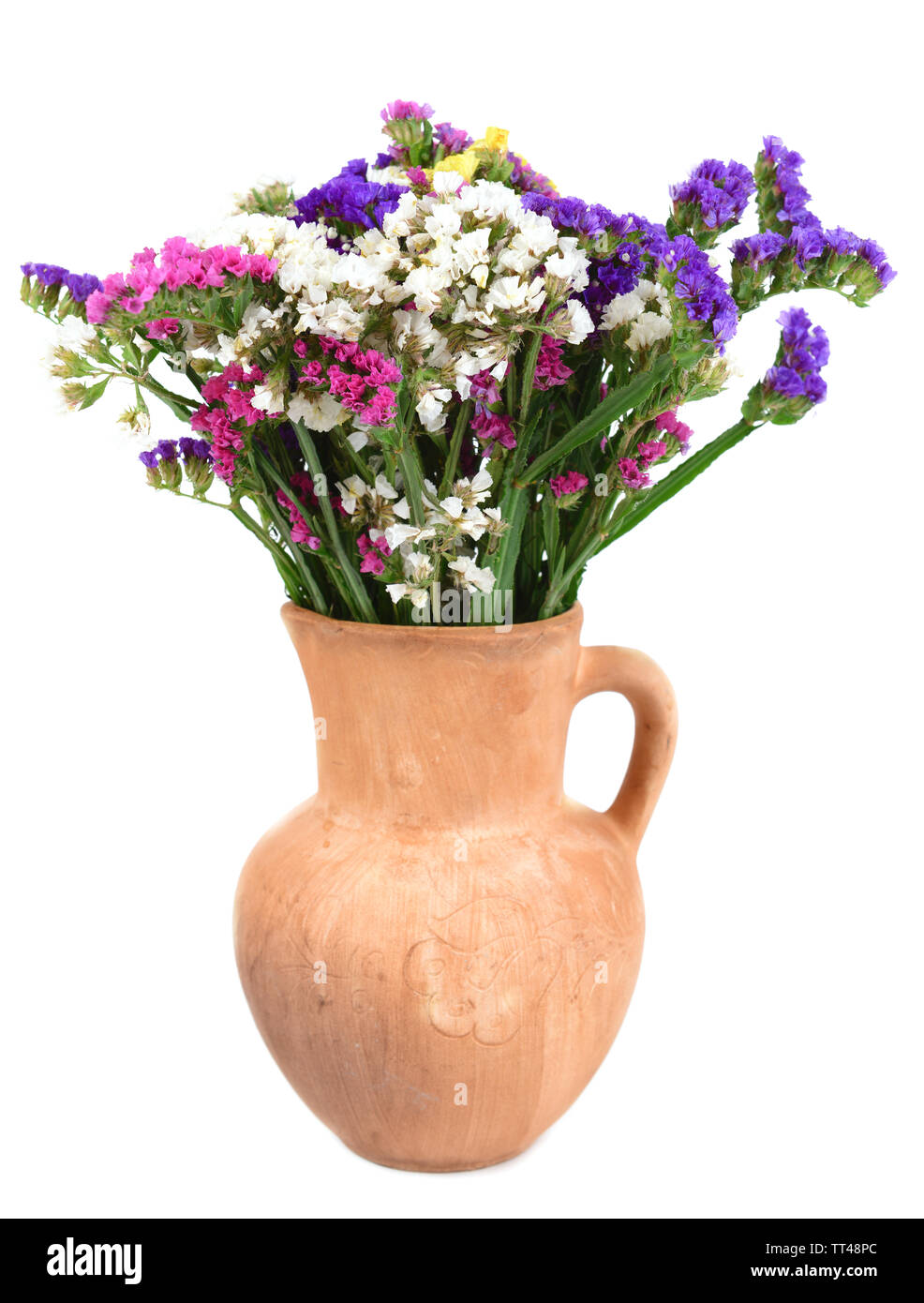 Beautiful bouquet of bright flowers in pitcher isolated on white Stock ...