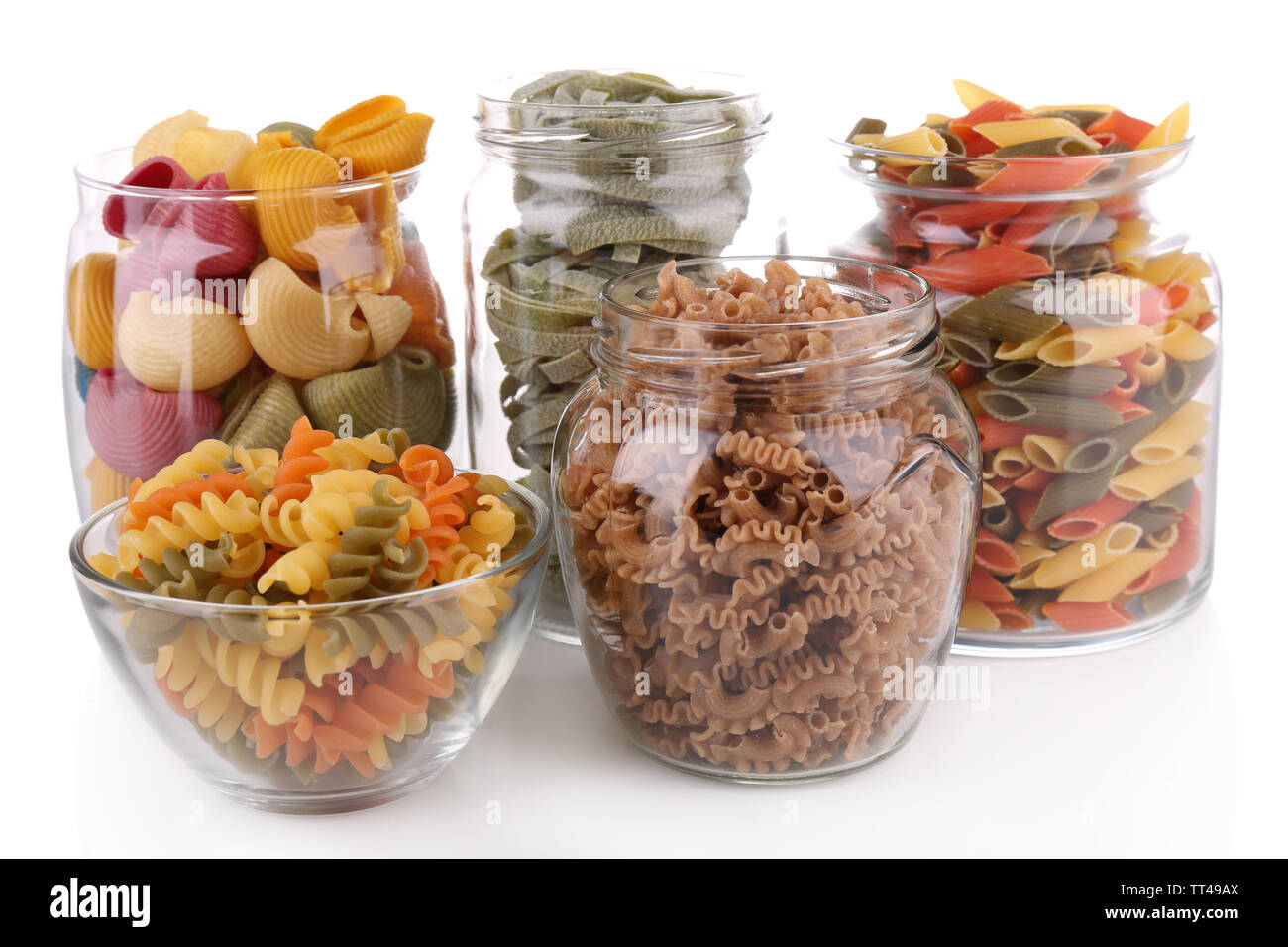 Colorful pasta in glass jars isolated on white Stock Photo - Alamy