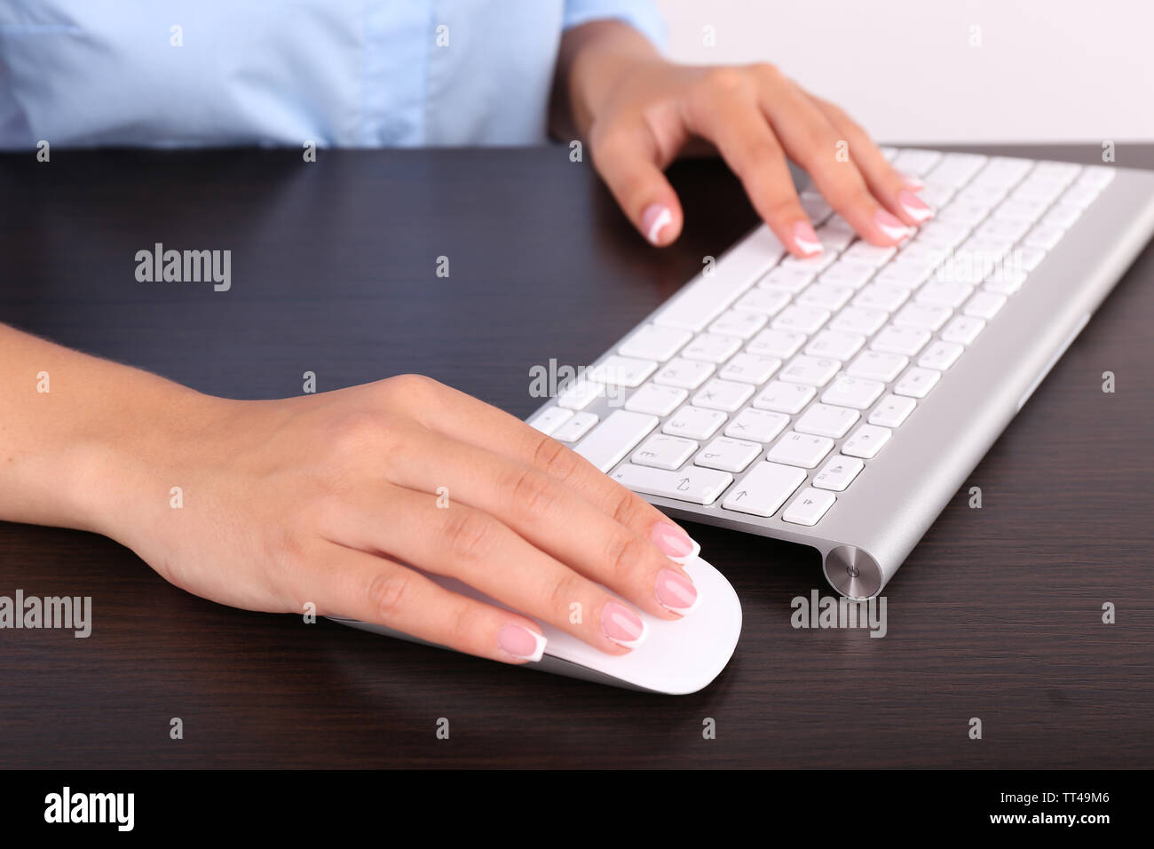 Female hand holding computer mouse, close-up Stock Photo - Alamy