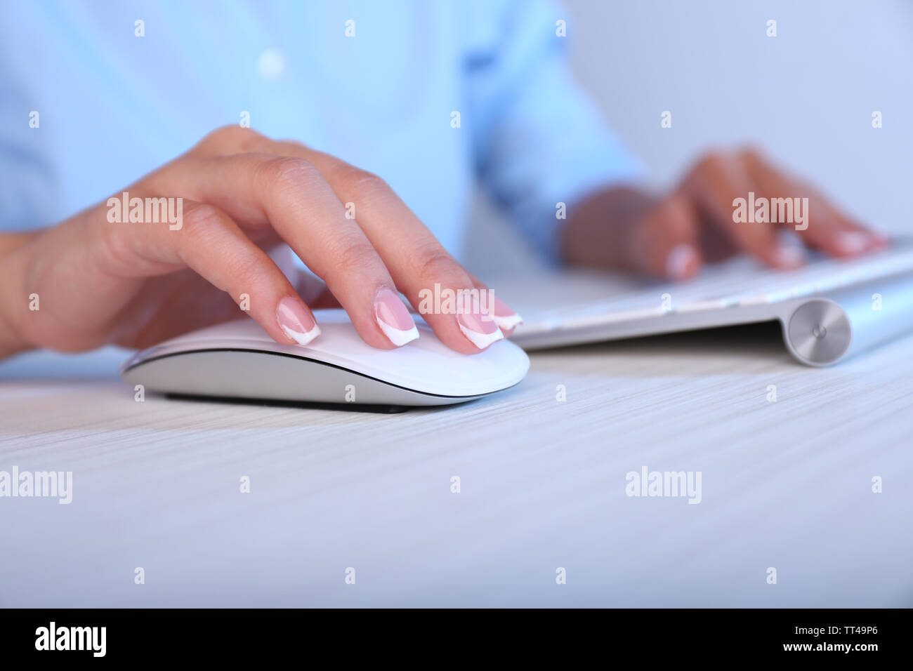Female hand holding computer mouse, close-up Stock Photo - Alamy