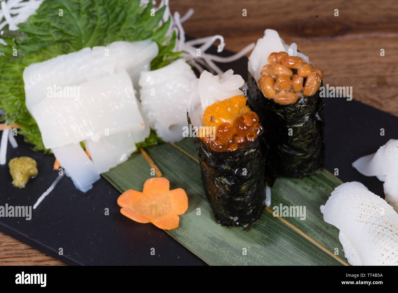 Plate composed of squid and cuttlefish sashimi, caviar and fermented ...