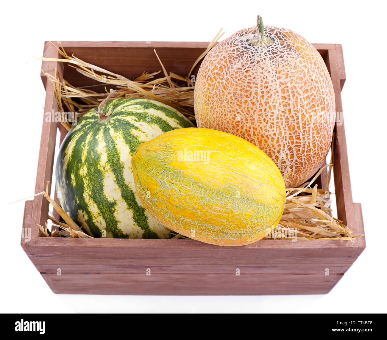 Melons and watermelons in wooden box isolated on white Stock Photo - Alamy