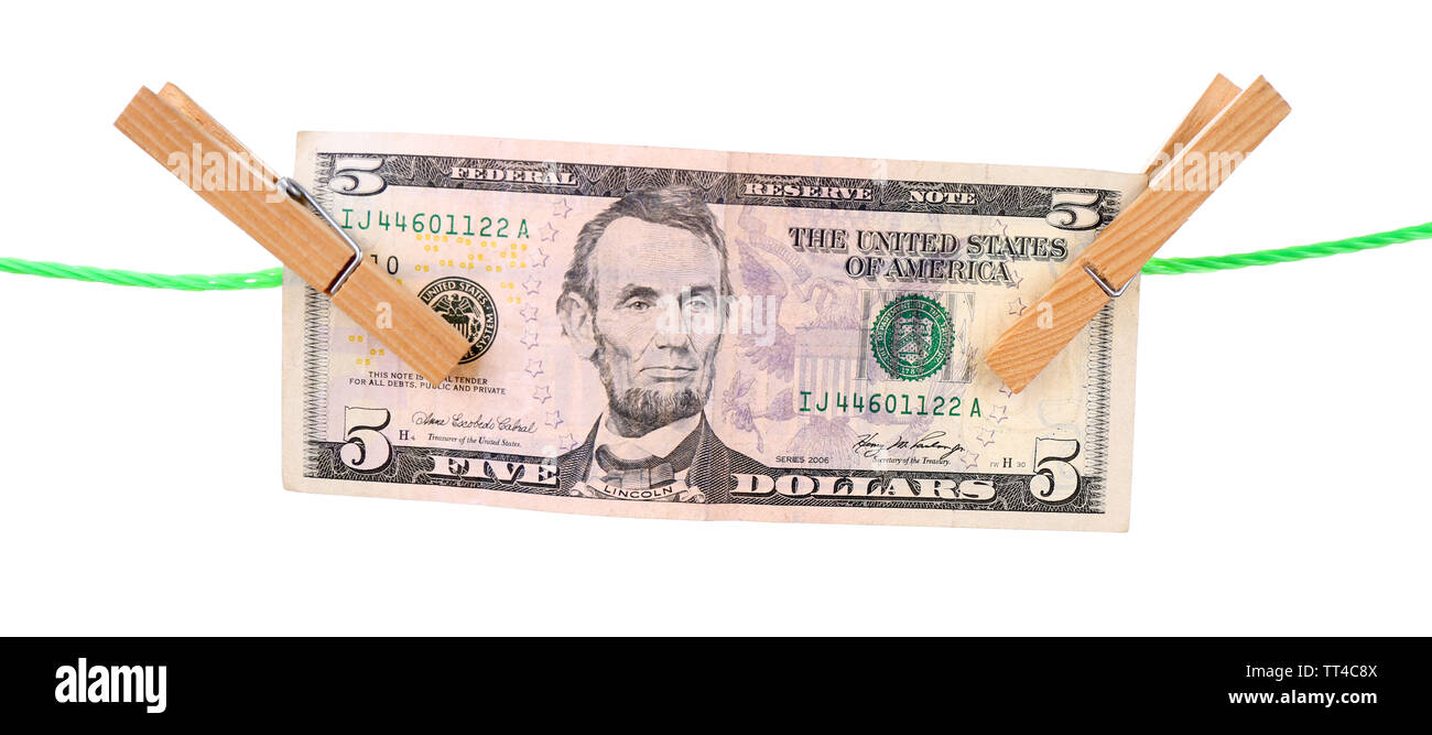 Dollar bill hanging on rope attached with clothes pins. Money ...