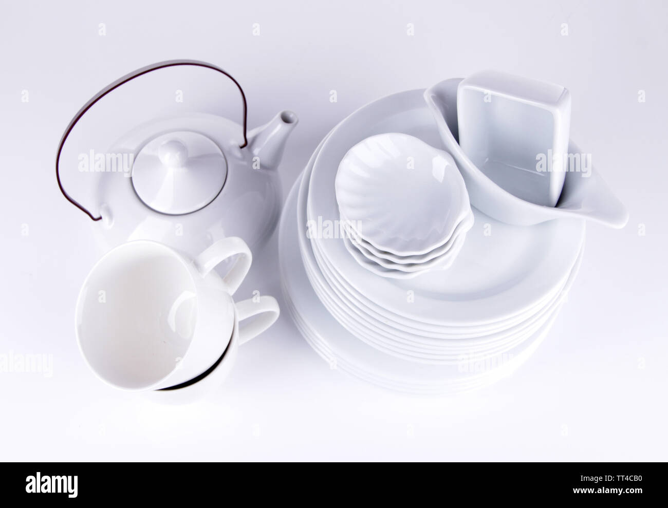 White crockery and kitchen utensils, isolated on white Stock Photo - Alamy