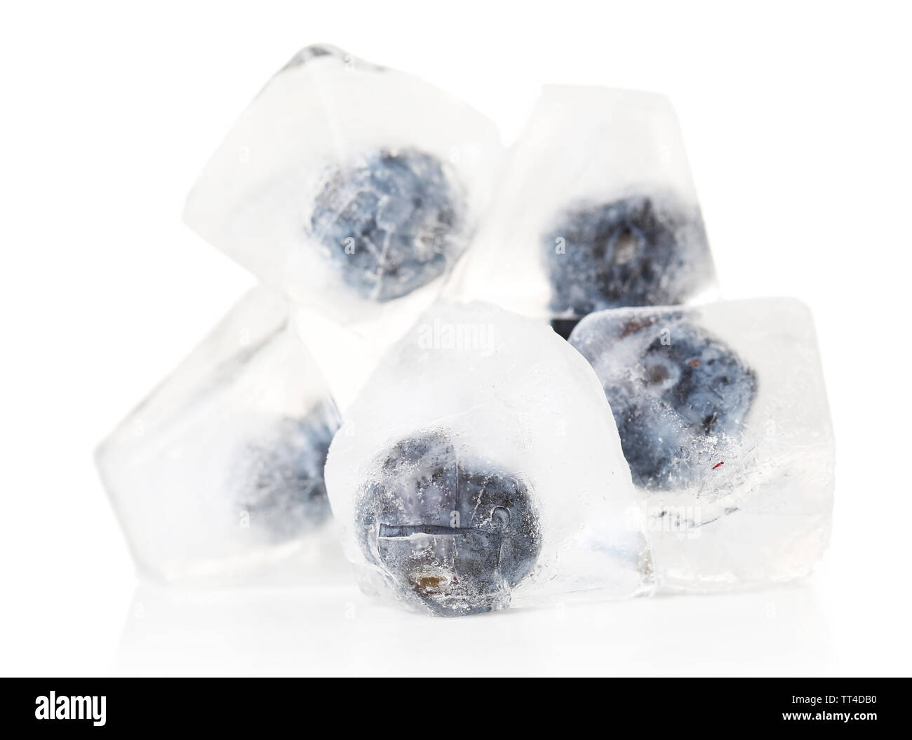 Ice cubes with blueberry, isolated on white Stock Photo - Alamy