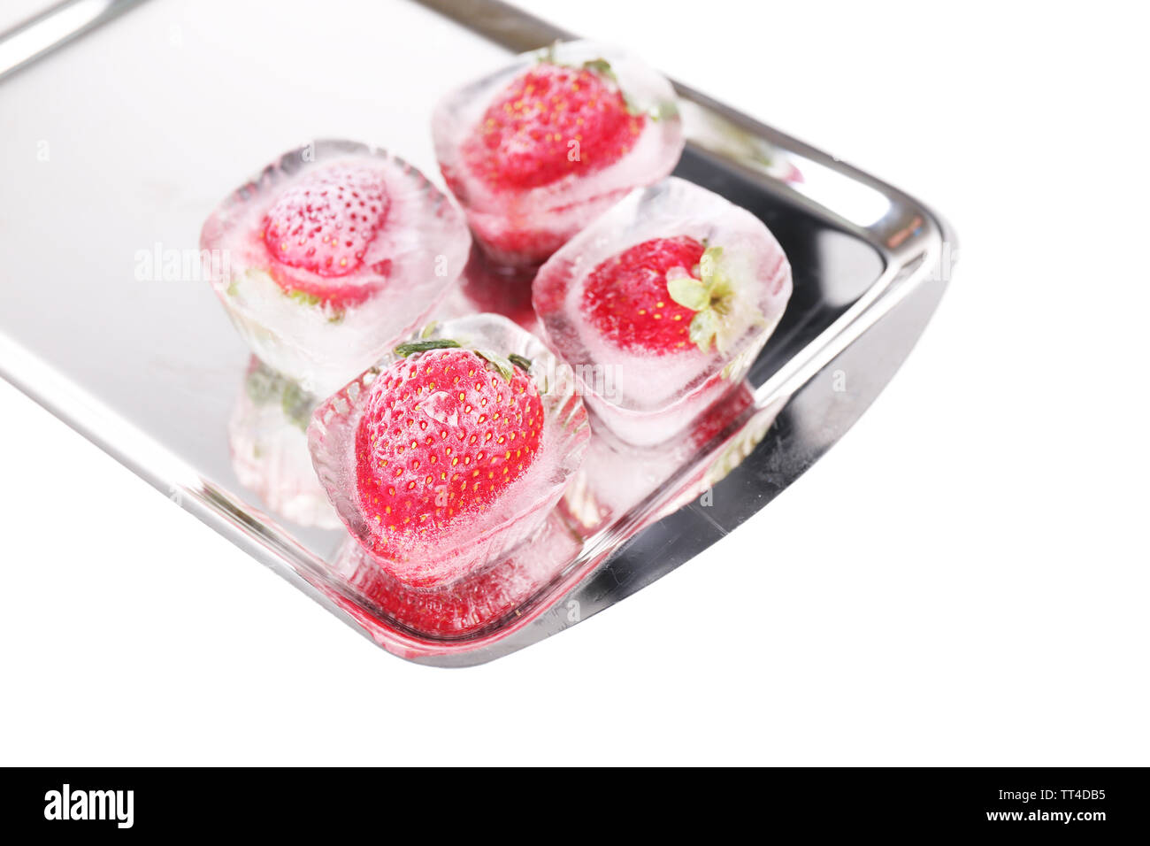 Ice cubes with strawberry on tray isolated on white Stock Photo - Alamy