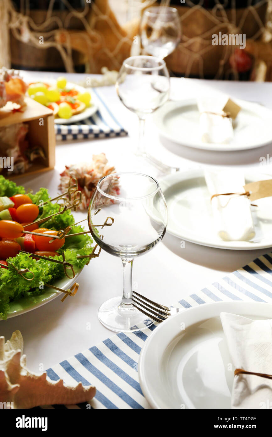 Restaurant table setting in sea theme Stock Photo - Alamy
