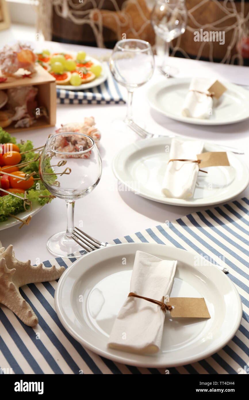 Restaurant table setting in sea theme Stock Photo - Alamy