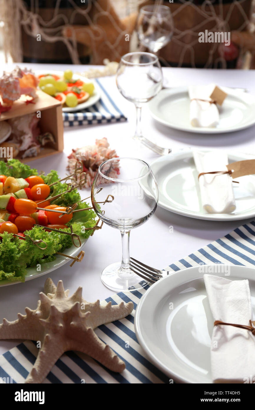 Restaurant table setting in sea theme Stock Photo - Alamy
