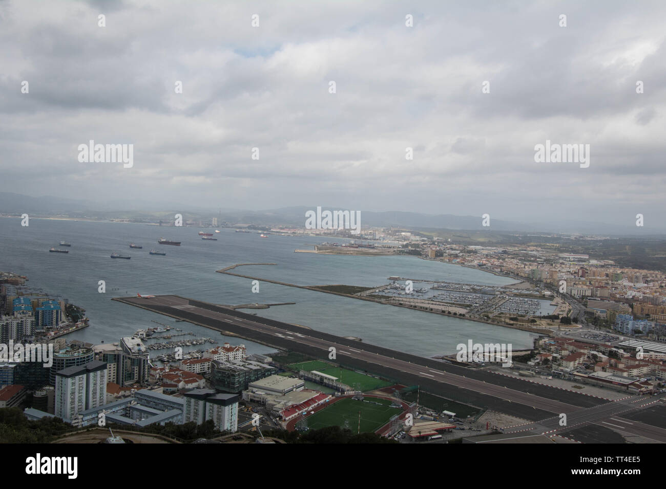 Gibraltar runway flight landing port sea water boat boats ship ships ...