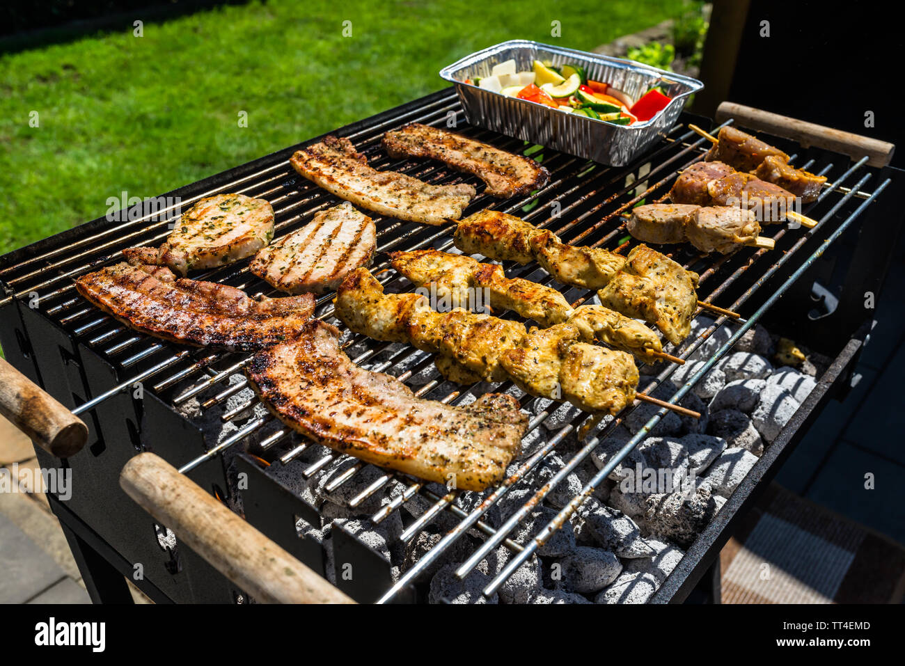 Different types of meat fried on the home grill, standing on a home ...