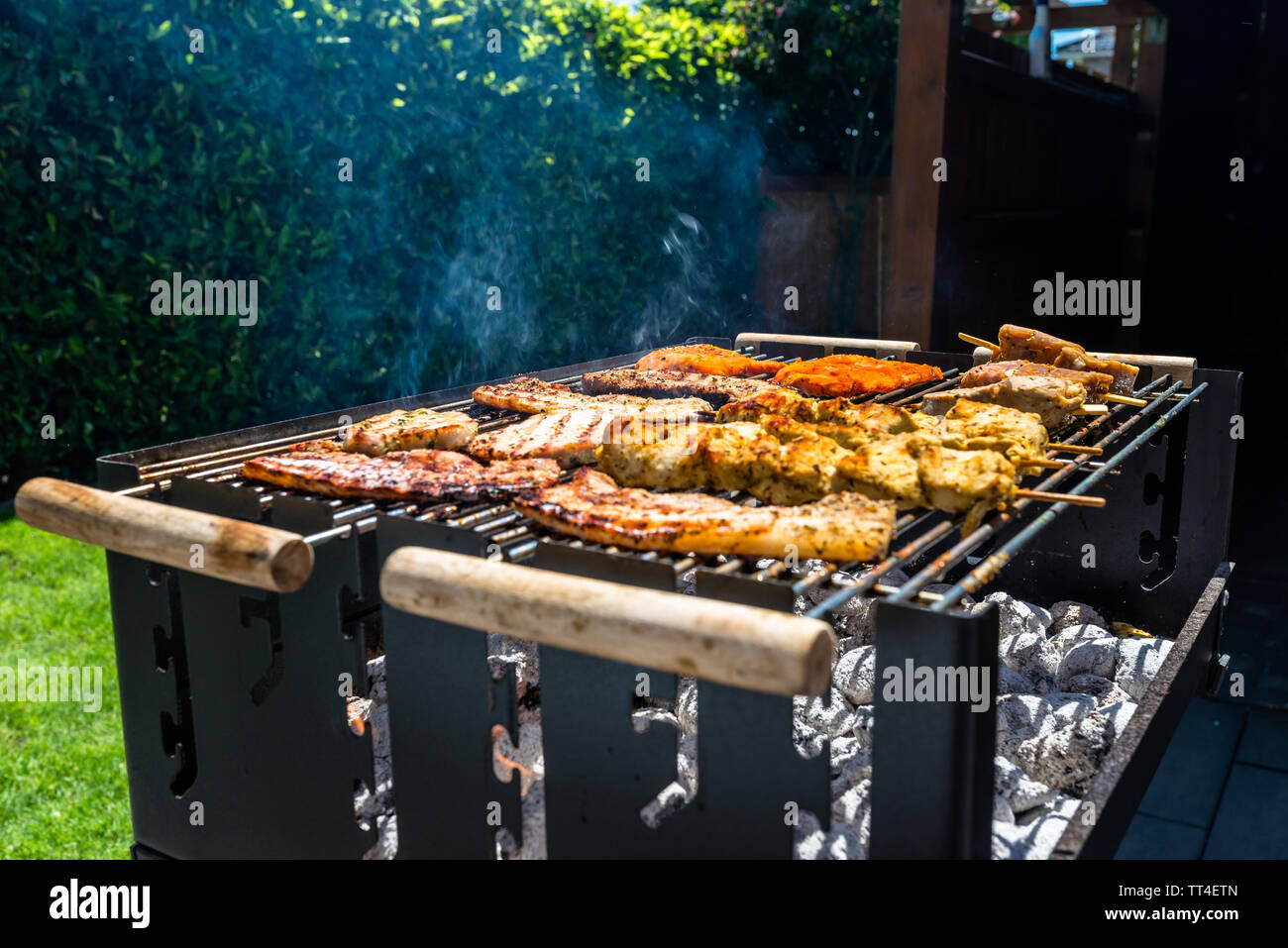 Different types of meat fried on the home grill, standing on a home ...