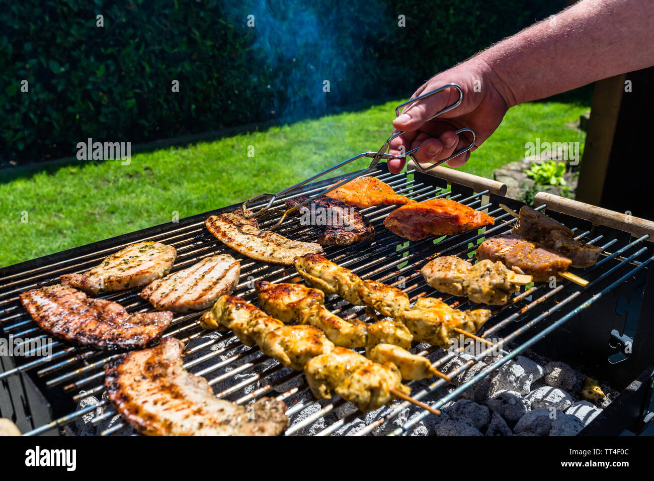 Different types of meat fried on the home grill, standing on a home ...
